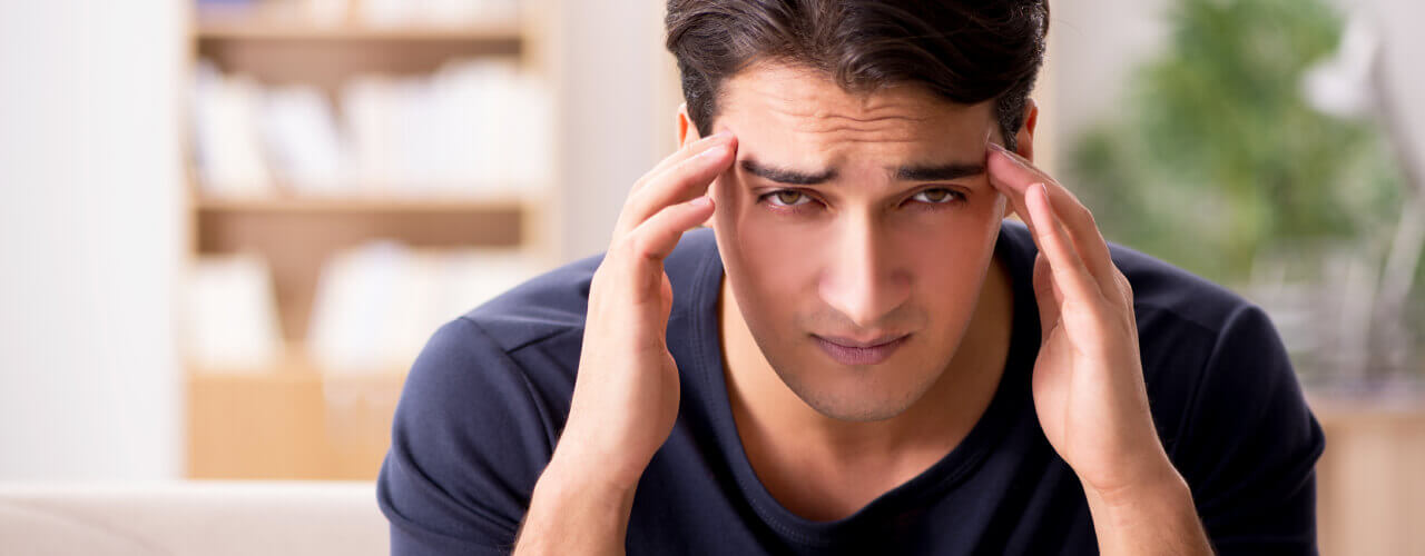How does stress contribute to headaches?